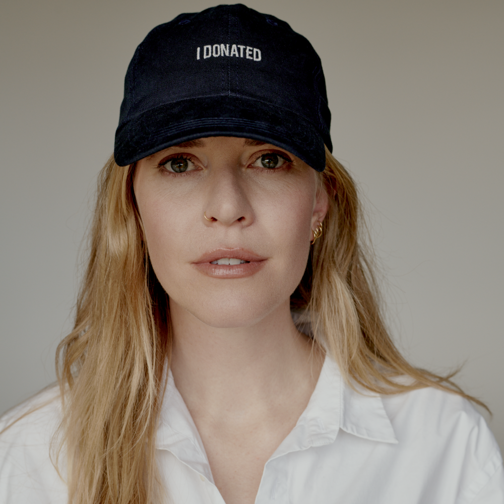 WWF Statement Cap - blauw met beige tekst - I donated - Tess van Zalinge